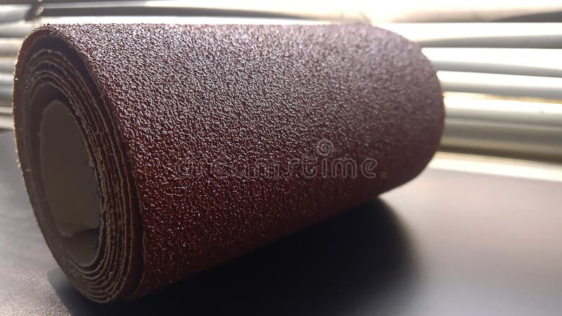 Coarse sandpaper roll stock image. Image of sand, polish - 231496743