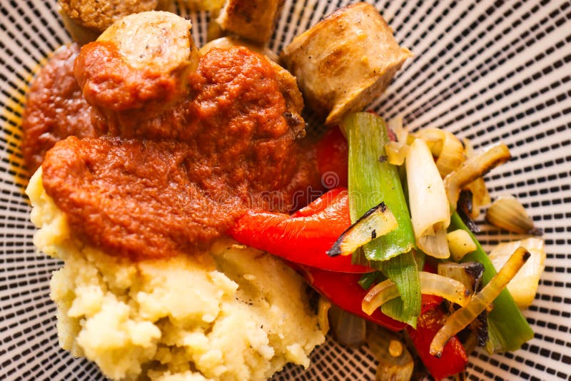 Coarsely Chopped Mashed Potatoes with Fried Vegetables and Sausages ...