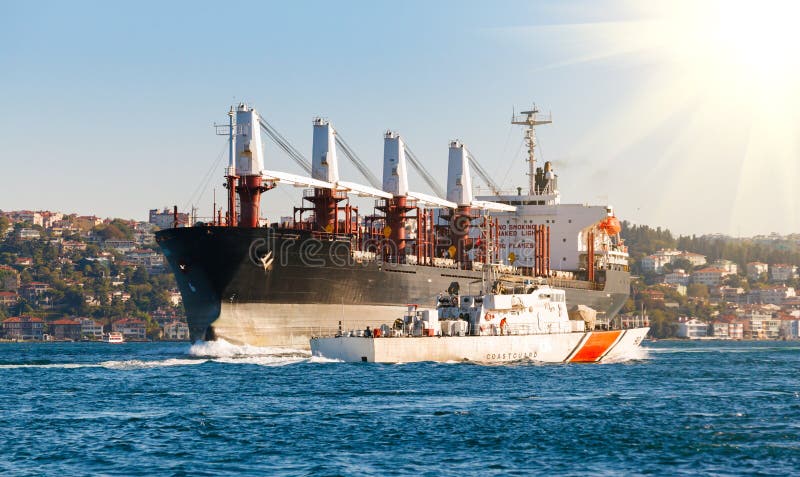 Coast Guard Vessel and Large Cargo Ship Proceeding Along the Bosphorus ...