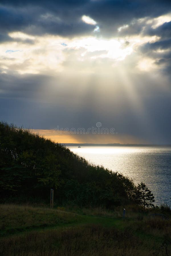 On the Coast of Hundested. Sun Rays Breaking through the Dramatic Sky ...