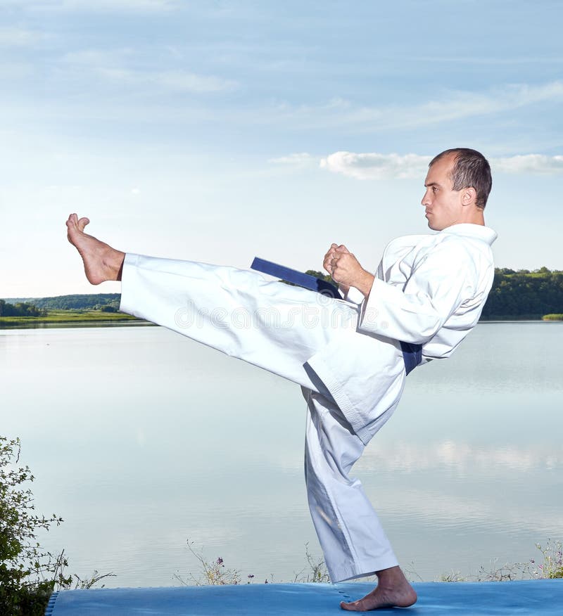 On Coast of Lake Athlete Beats a Kick Leg Forward Stock Image - Image ...