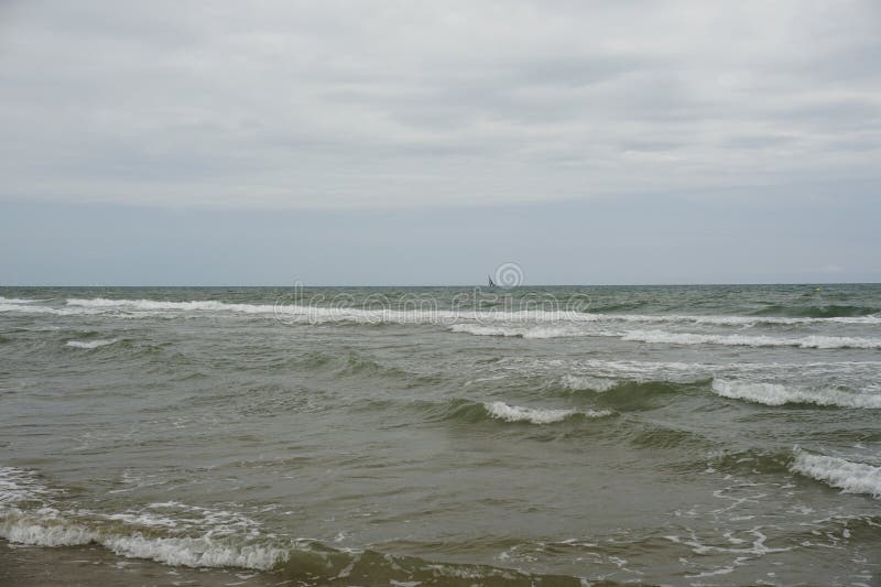 Coast of Spain. Surf Waves on the Beach of Valencia. Horizon. Clouds ...