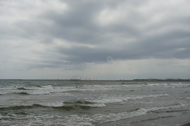 Coast of Spain. Surf Waves on the Beach of Valencia. Horizon. Clouds ...