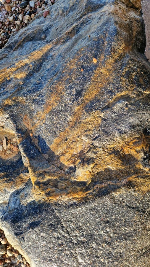 Coastal Boulder with Natural Orange Veins Close-Up Stock Image - Image ...