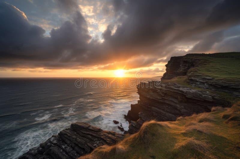Coastal Cliff View, with a Dramatic Sunset in the Sky and Clouds Stock ...