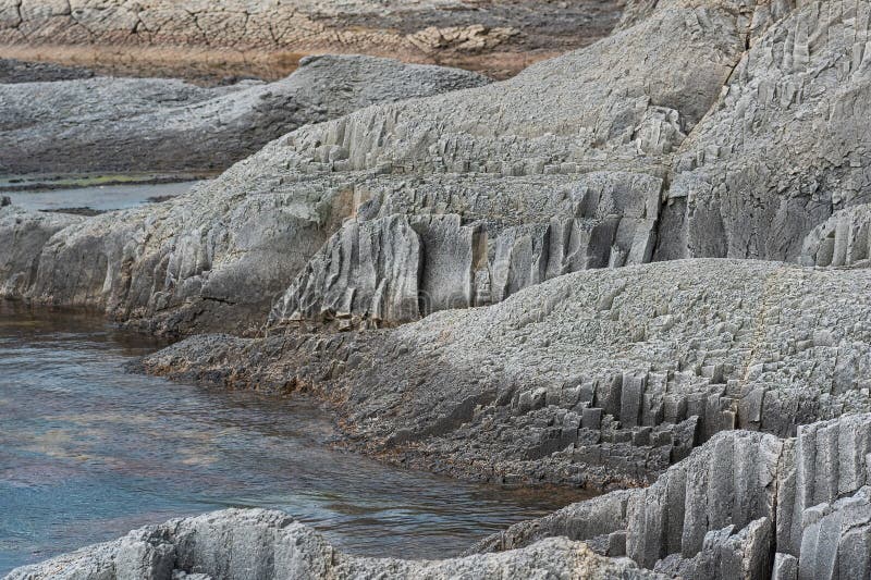 Coastal Cliffs Formed by Columnar Basalt at Low Tide Stock Image ...