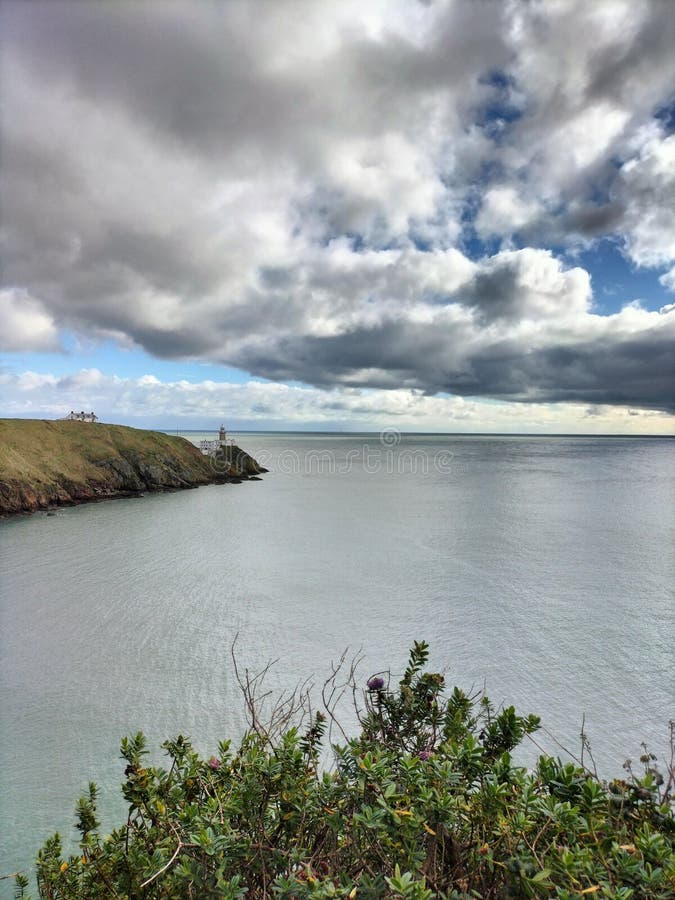 Coastal Landscape with Lighthouse and Cloudy Sky Stock Image - Image of ...