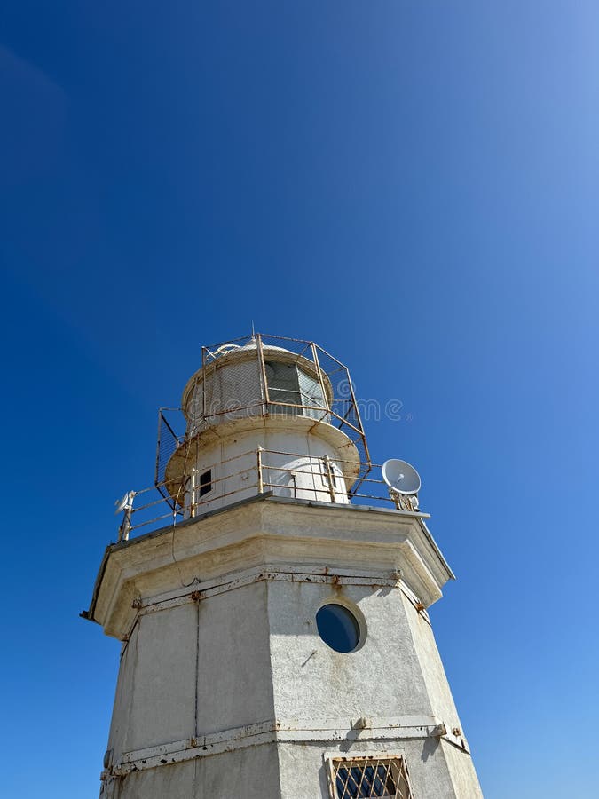 Coastal Lighthouse for Navigation on Blue Sky Background Stock Photo ...