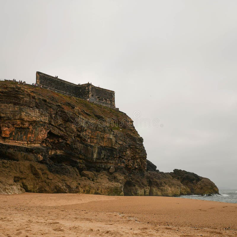 Coastal Rock at a Sandy Seaside on a Dark Day Stock Photo - Image of ...