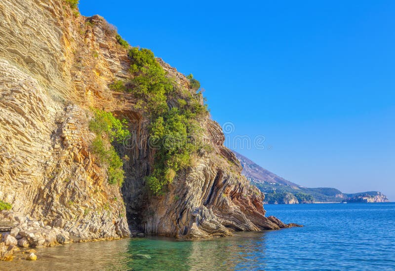 Cliff in water stock image. Image of water, cliff, coast - 141345783