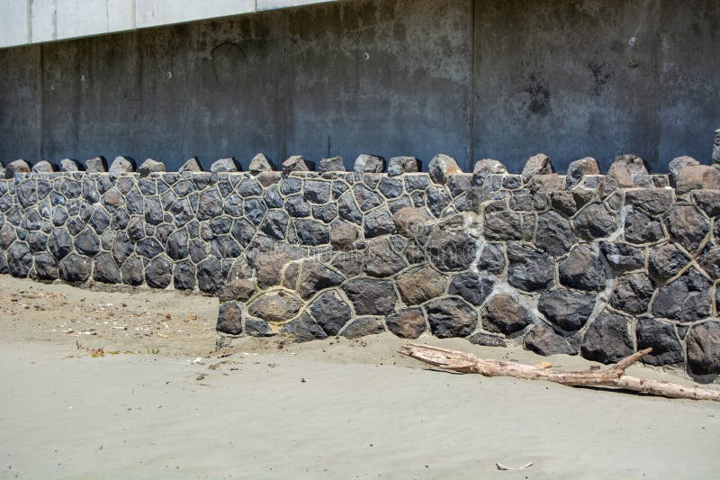 Coastal Stone Wall on Sandy Beach Stock Photo - Image of temple ...
