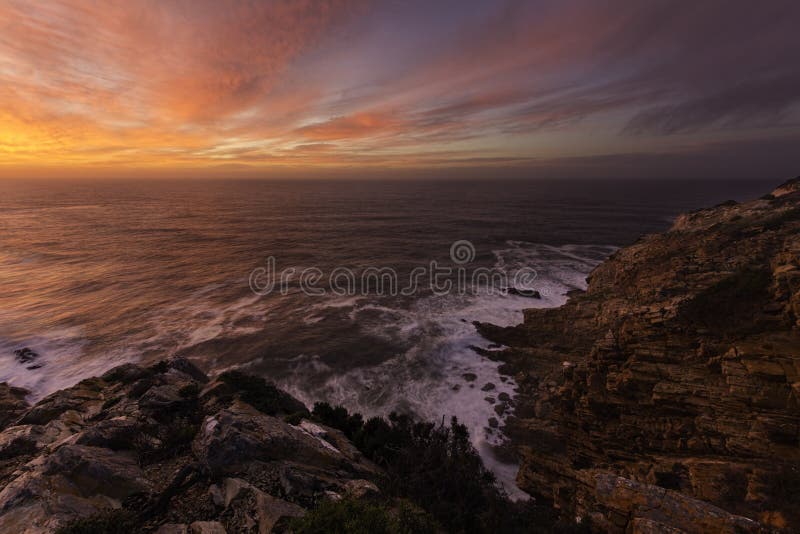 Coastal sunset cliffs stock photo. Image of orange, water - 60254678