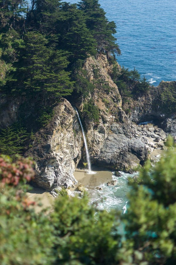 Coastal Waterfall Cascading Onto Pacific White Sand Beach Surrounded by ...