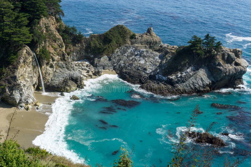 Coastal Waterfall Cascading Onto Pacific White Sand Beach Surrounded by ...