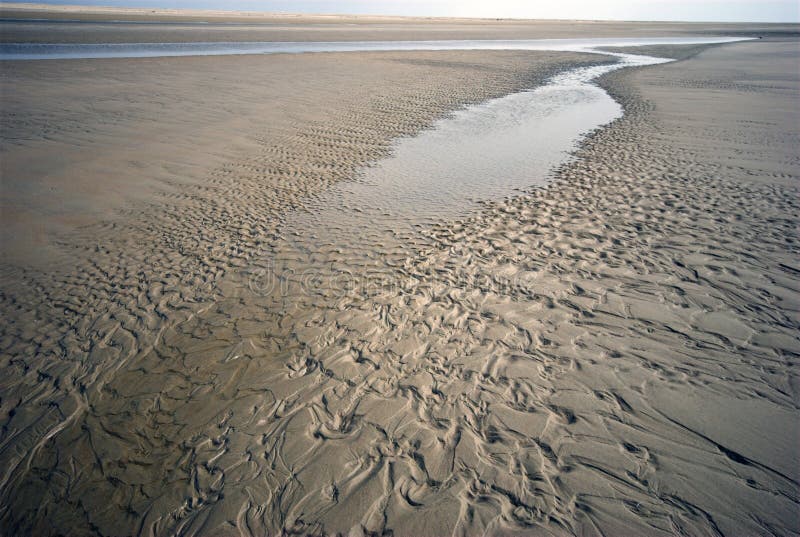 Sand at low tide stock image. Image of landscape, water - 27483175