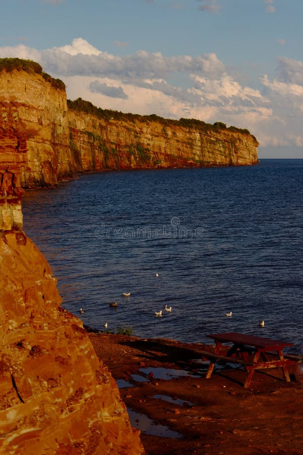 Coastline with the Red Earth at Caplan, Quebec Stock Photo - Image of ...