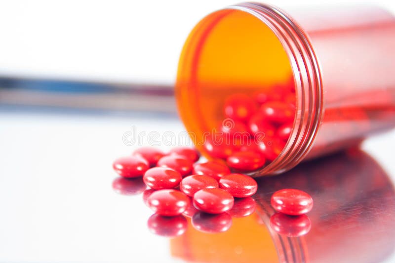 Coated Red Tablet and Brown Bottle on Dispensing Tray Stock Image ...