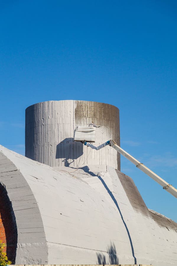 Coating the Building Structure with White Lime. Painting a Concrete ...
