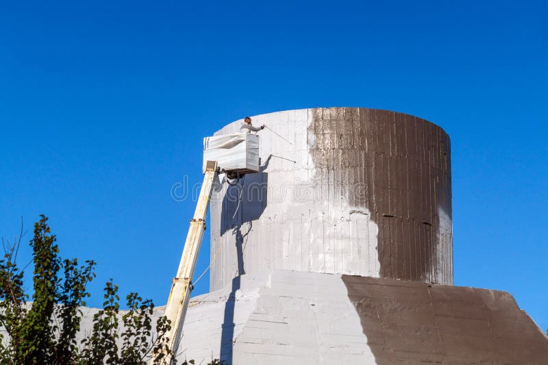 Coating the Building Structure with White Lime. Painting a Concrete ...
