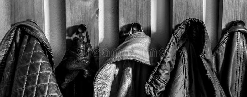 Black and White Images of a Row of Coats Hanging on a Coat Rack Stock ...
