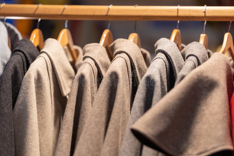 Coats Hanging on Hangers in a Clothing Store Stock Photo - Image of ...