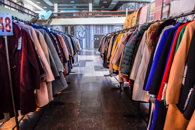Coats and Jackets on Hangers in the Store. Sale of Outerwear. Stock ...