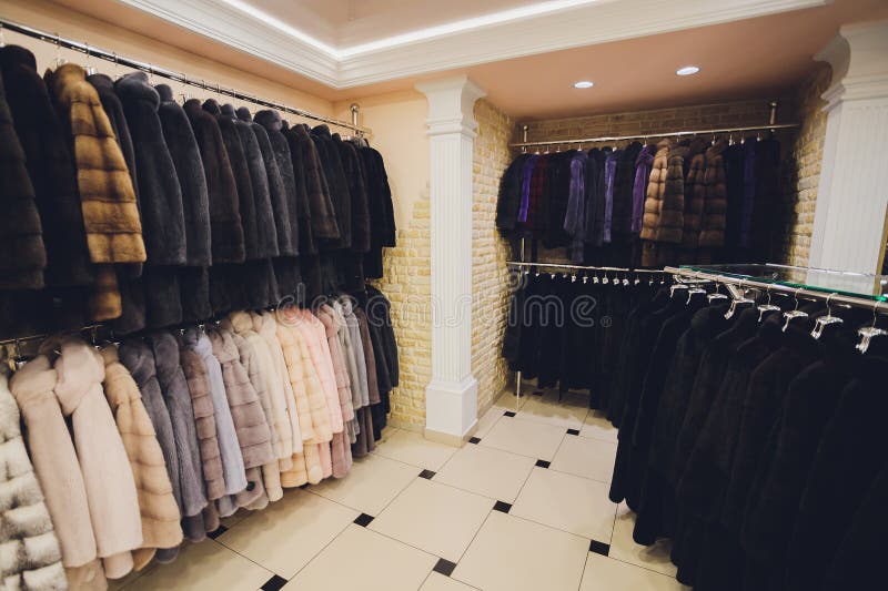 Coats and Jackets on Hangers in the Store. Sale of Outerwear. Stock ...