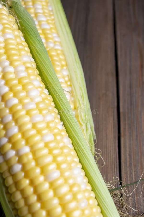 A Cob of Corn on the Table. on the Wooden Table is Young Corn. a Head ...