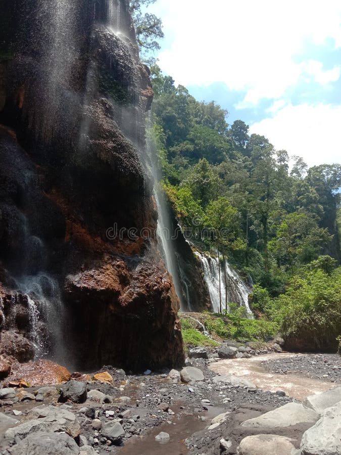 Coban Pelangi Waterfall stock image. Image of waterfall - 210479793