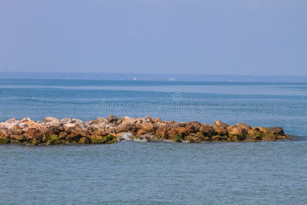 Cobble stone mole in sea stock photo. Image of architecture - 68753868