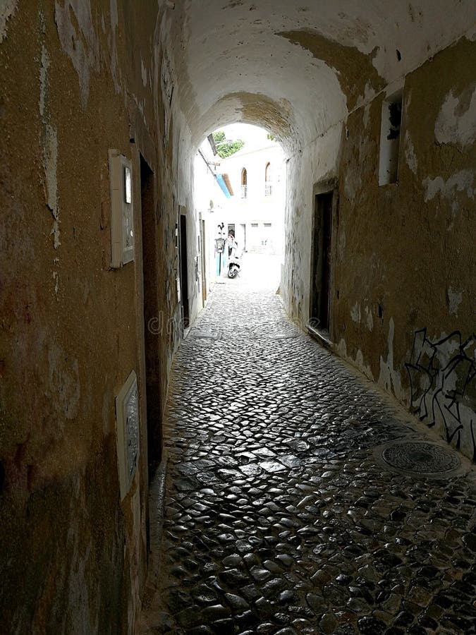 Cobbled alley with a dome stock image. Image of stone - 95618207