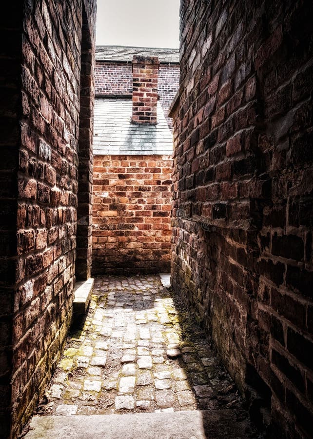 Cobbled Passageway between Historic Red Brick Cottage Walls Stock Photo ...