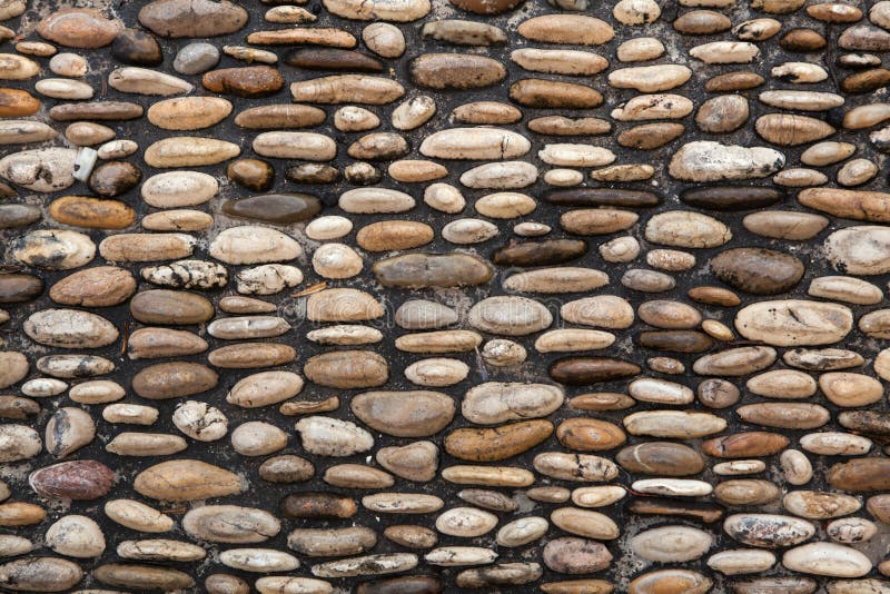 Cobbled Pavement Made of River Rounded Pebbles. Background Texture ...