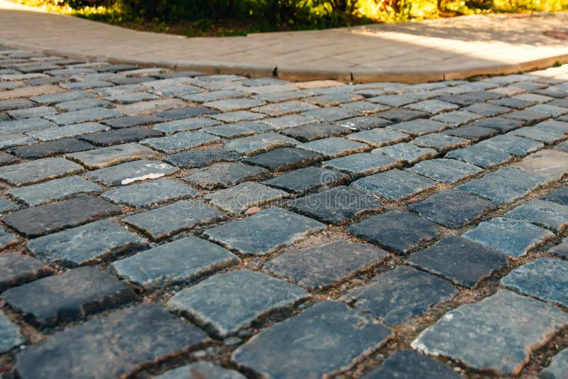 Cobbled Stone Road Shown at a Small Angle, Reflection of Light Seen on ...