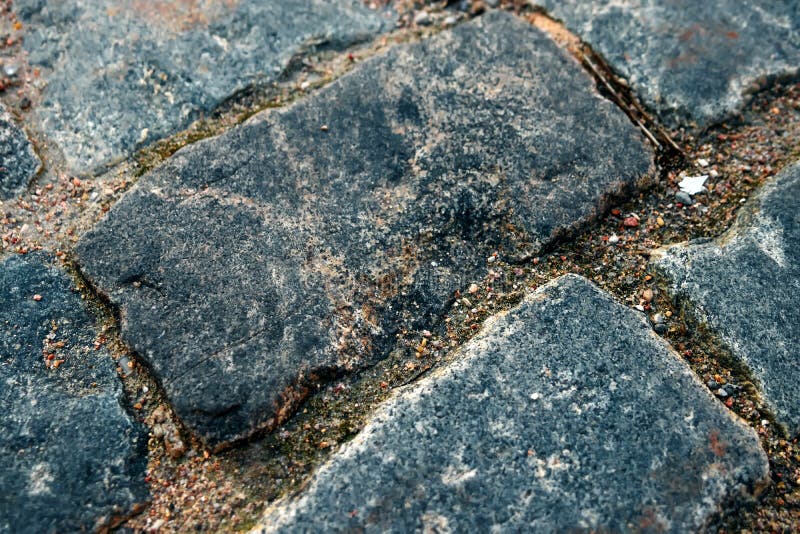 Cobbled Stone Road Shown at a Small Angle, Reflection of Light Seen on ...
