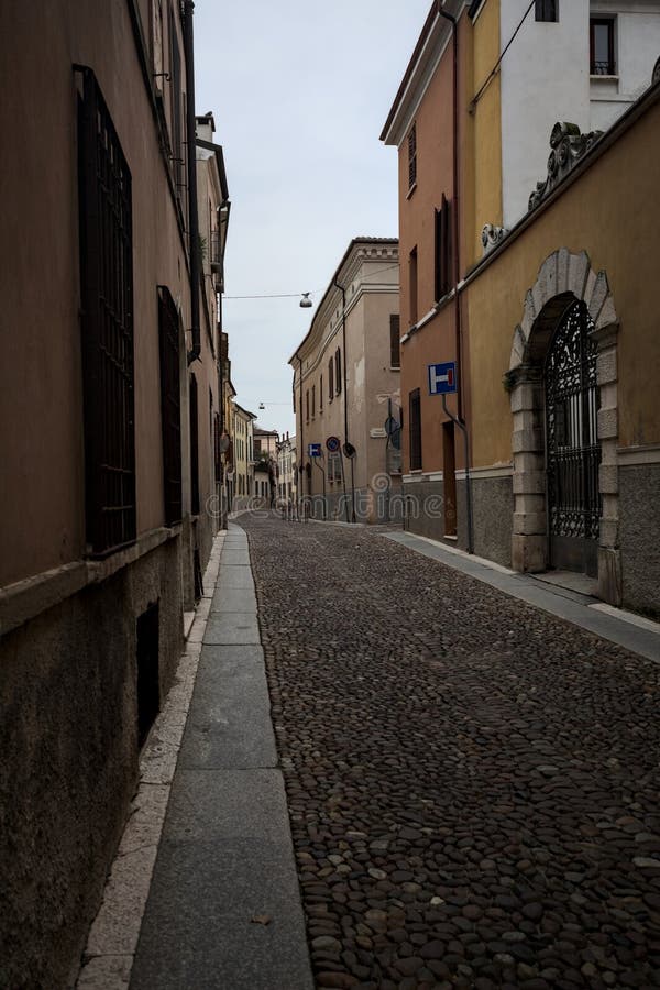 Cobbled street and a gate stock photo. Image of dwelling - 363720728