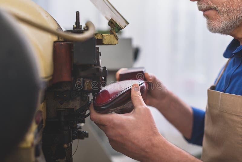 Cobbler in Apron Stitching a Shoe Stock Photo - Image of craft, fashion ...
