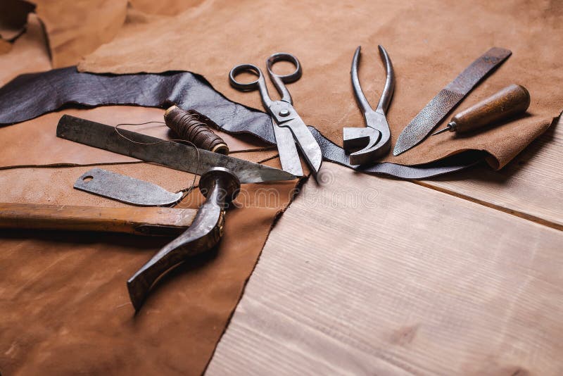 Cobbler Tools in Workshop on the Wooden Table . Space for Text. Stock ...