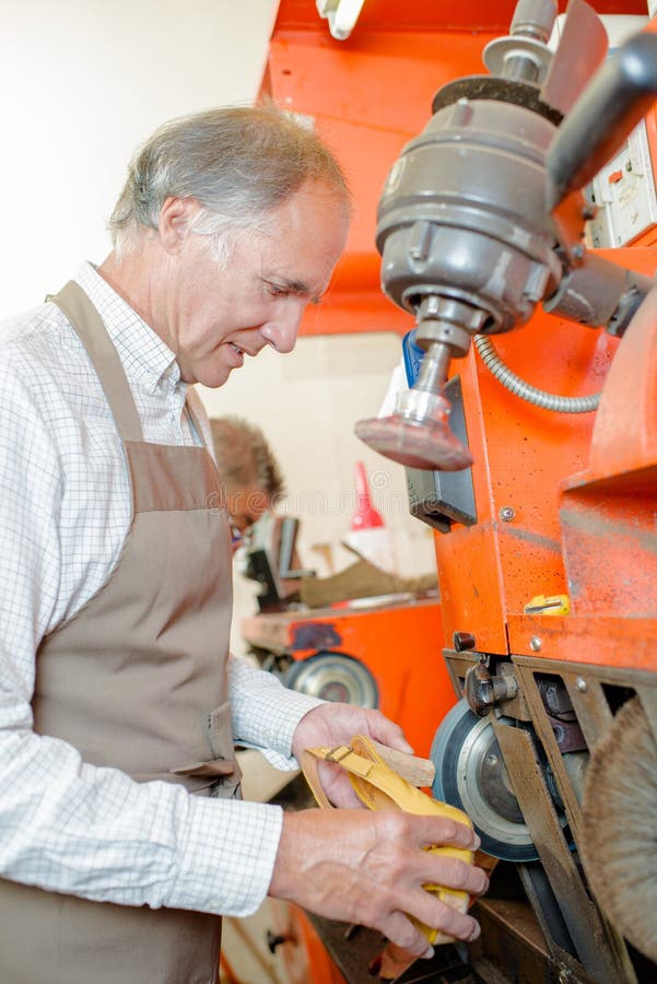 Cobbler Using Machinery on Heel Shoe Stock Photo - Image of grind ...