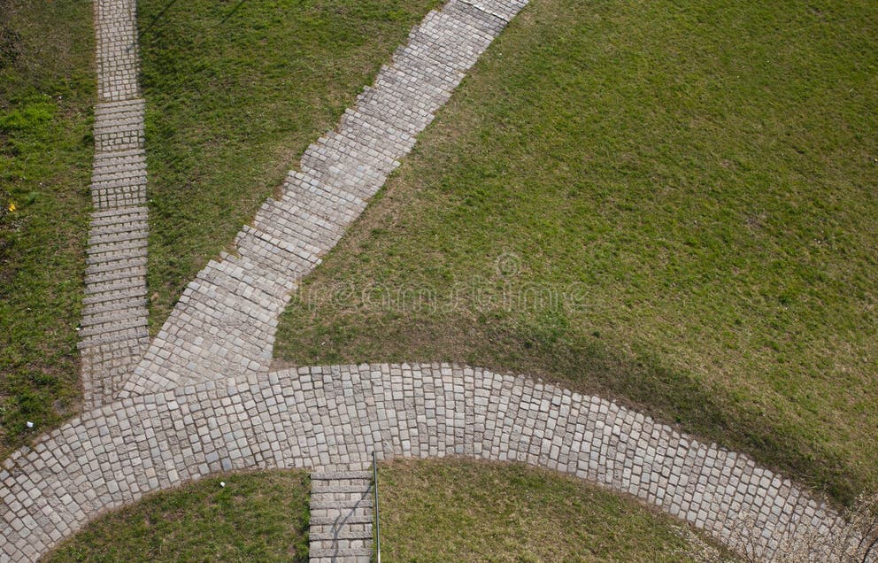 Cobblestone path in grass stock photo. Image of plants - 30542888