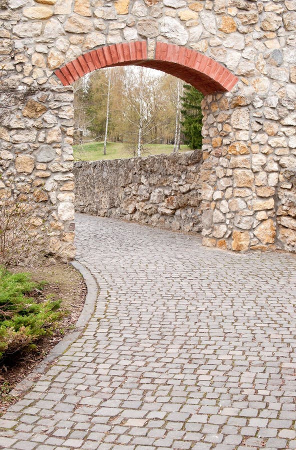 Cobblestone Path Leading To an Archway Stock Image - Image of grass ...