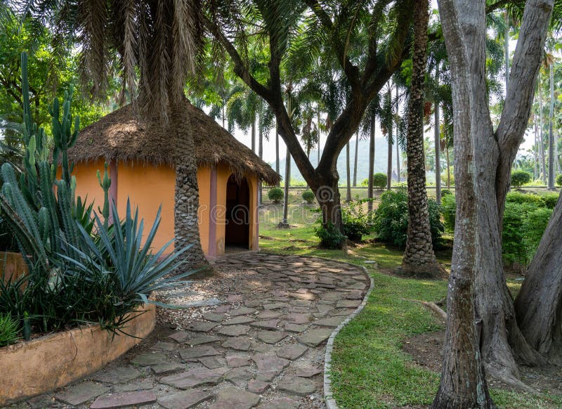 Cobblestone Path Leading To a Small Hut Surrounded by Trees Stock Image ...