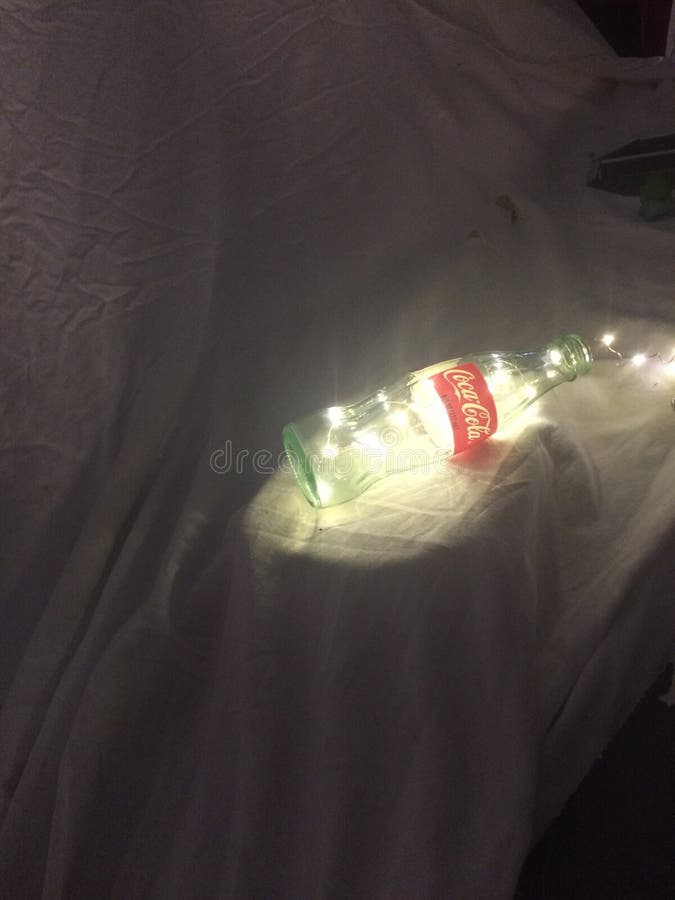 Coca-Cola bottle spilling editorial image. Image of lights - 137750565