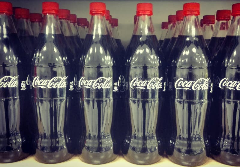 Coca cola bottles line up editorial photo. Image of line - 95045676