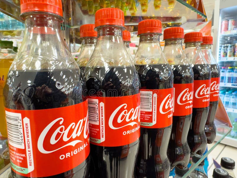 Coca-cola Bottles on Store Shelf Displaying Iconic Red Branding ...