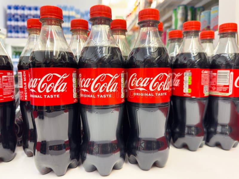 Coca-cola Bottles on Store Shelf Displaying Original Taste Label ...