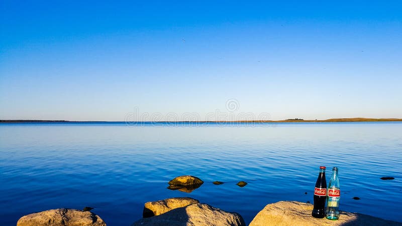 Coca-Cola and the lake editorial stock photo. Image of cocacola - 77443388