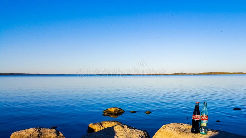 Coca-Cola and the lake editorial stock photo. Image of cocacola - 77443388