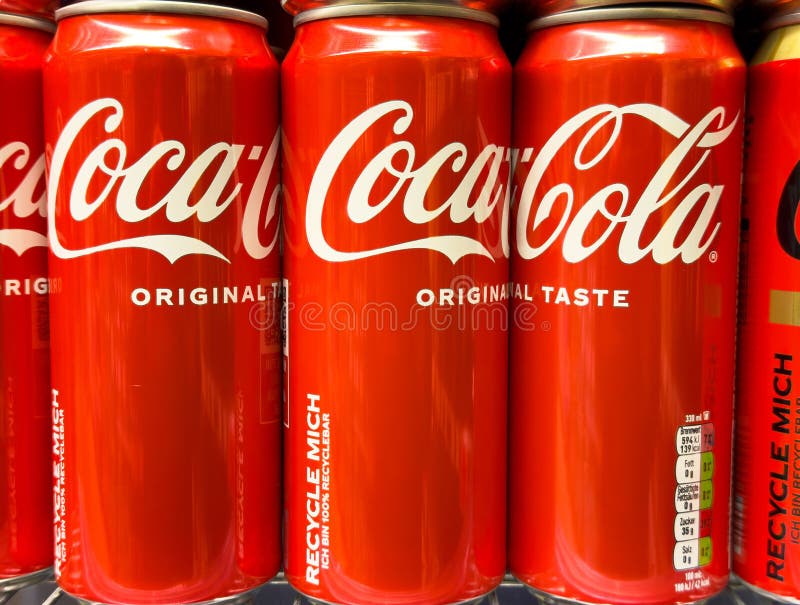 Coca-cola Original Taste Cans in a Row Displaying Logo and Branding ...