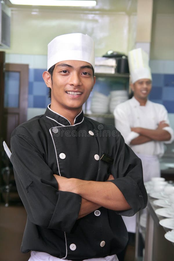 Cocinero Que Se Coloca En El Restaurante Imagen de archivo - Imagen de ...